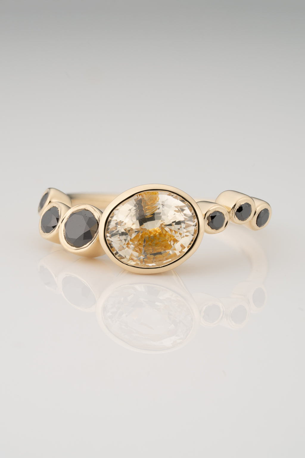 SAPPHIRE AND BLACK DIAMOND GRADUATED RING